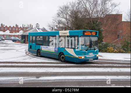 Arriva buses at Sevenoaks Bus Station, Kent UK during falling snow ...