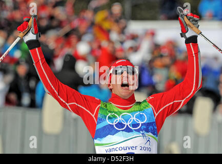 Bill Demong of the USA reacts at the finish line after the 10km Cross ...