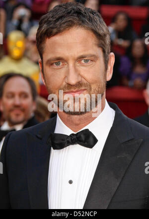 Gerard Butler arrives at the Oscars on Sunday, Feb. 9, 2020, at the ...