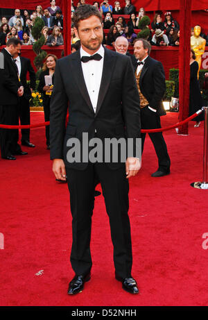 Gerard Butler arrives at the Oscars on Sunday, Feb. 9, 2020, at the ...