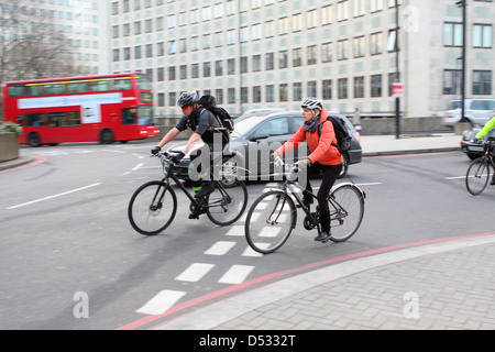 Cyclists and traffic entering a roundabout in London, England Stock ...