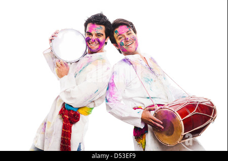 Friends celebrating Holi with musical instruments Stock Photo - Alamy