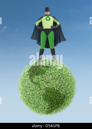 Eco superhero with green recycle arrow symbol on chest standing ...