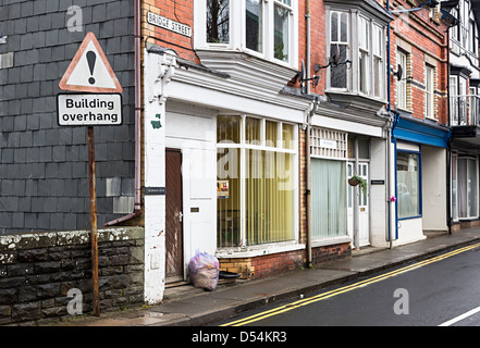 Building overhang sign in Rhayader Powys Mid Wales UK Stock Photo - Alamy