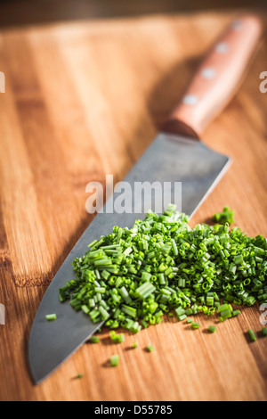 Chopping chives Stock Photo - Alamy