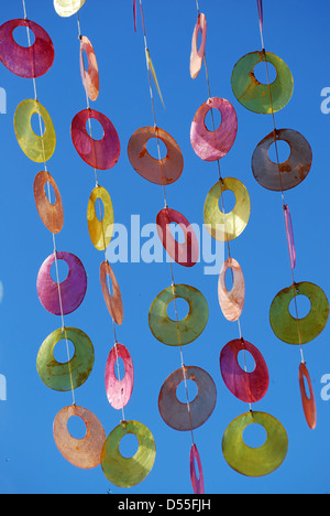 Funny window decoration with colored disks Stock Photo - Alamy
