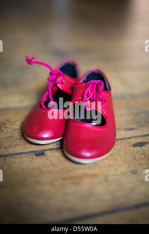 a childs red shoes Stock Photo - Alamy