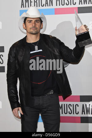 Brad Paisley holds his awards for Male Vocalist of the Year and Music ...