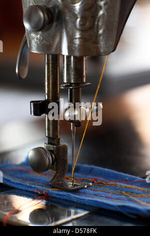 A visitor to the Museum of Sewing Machine eyes a Veritas sewing machine ...