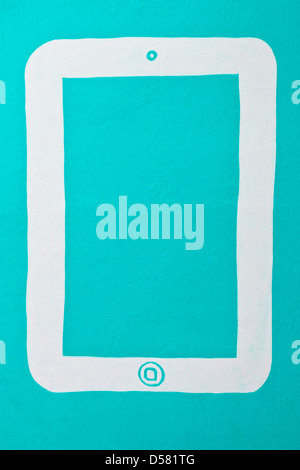 Tablet PC pictured at bright turquoise wall Stock Photo - Alamy