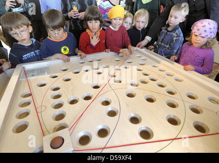 Children look at a new experiment in the exhibition 'Erlebnisland ...