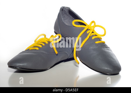 gray boots with yellow laces on a white background Stock Photo - Alamy