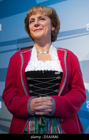 German Chancellor Angela Merkel's wax figure is dressed in a dirndl ...