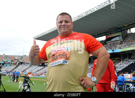 German shot putter Ralf Bartels throws at the Olympic stadium Lluis ...