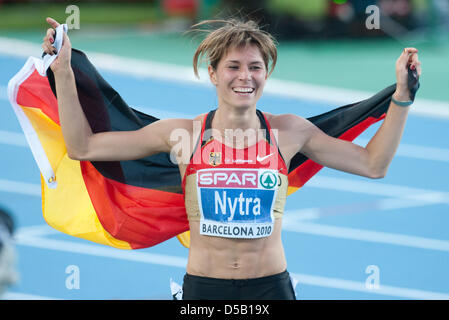 The German hurdler Carolin Nytra celebrates her bronze medal at the ...