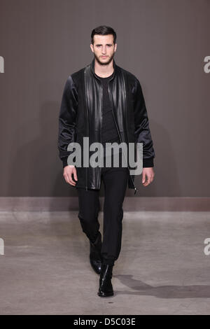 A model wears a creation as part of the Louis Vuitton men's Spring ...