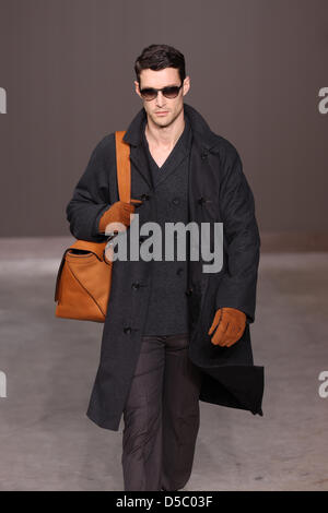 A model wears a creation as part of the Louis Vuitton men's Spring ...