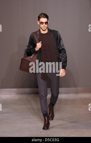 A model wears a creation as part of the Louis Vuitton men's Spring ...