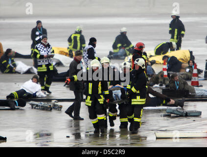 Firefighters and medics recover casualties during the disaster drill at ...