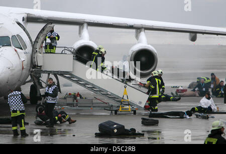 Firefighters and medics recover casualties during the disaster drill at ...