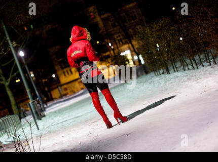 Prostitutes wait for customers on a snow-covered street in central ...