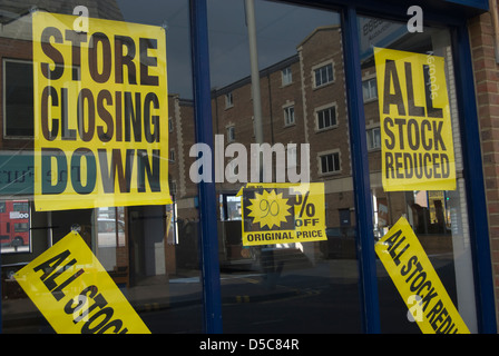 store closing down posters in the window of a woolworths store,england ...