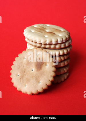 group of crackers isolated on red background Stock Photo - Alamy