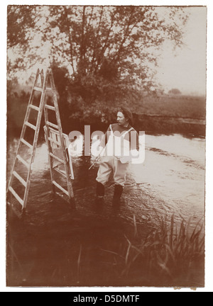 A portrait of American artist Louis Aston Knight painting outdoors near ...