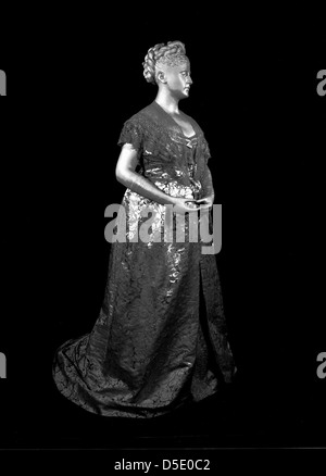 This ball gown from the 19th century features elegant design elements ...