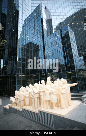 Illuminated Crowd Sculpture by Raymond Masson in front of a Stock Photo ...