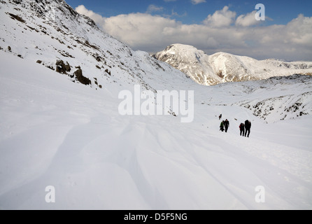 Walkers approaching Esk Hause in deep snow, with Great Gable in the ...
