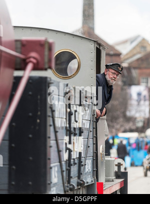 Steam locomotive with the driver looking out of the window on the East ...
