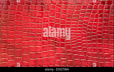 Red exotic Snake skin pattern as a wallpaper Stock Photo - Alamy