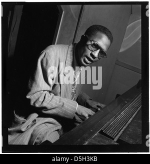 This photograph captures Thelonious Monk, a jazz legend, and Howard ...