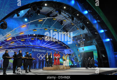 Medalist pose on the podium during the medal ceremony at the Luge ...
