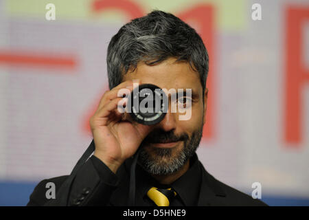 Director Babak Najafi poses with the 'Best First Feature Award' for his ...