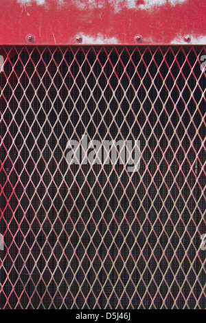 a distressed red metal grate pattern Stock Photo - Alamy