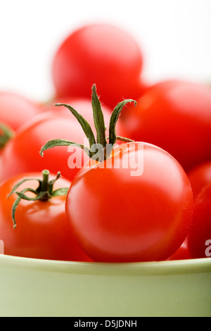 Mini cherry tomatoes isolated on white background Stock Photo - Alamy