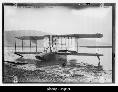 An image of the Curtiss Model F seaplane on the shoreline, a biplane ...