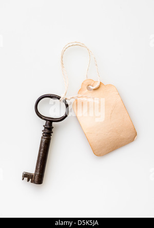 Old key with a tag Stock Photo - Alamy