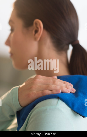 Woman touching aching back Stock Photo - Alamy