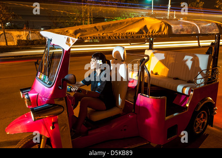 Thai Girl driving a Pink Tuk Tuk Stock Photo - Alamy