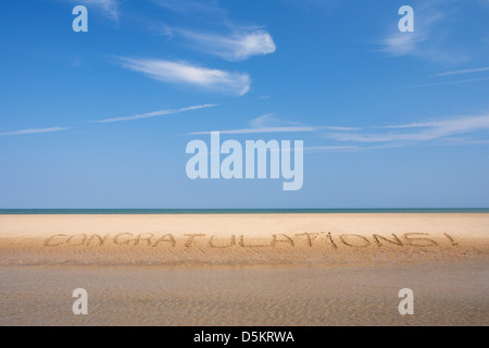 CONGRATULATIONS; MESSAGE; WRITTEN; SAND; BACKGROUND; SKY; SAND; BEACH ...