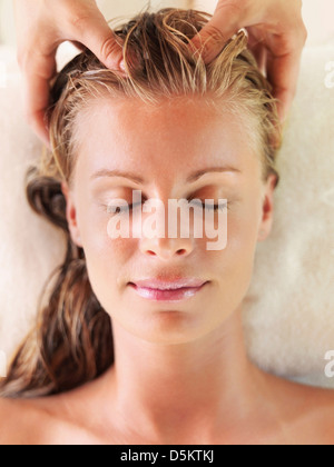 Woman enjoy receiving head massage Stock Photo - Alamy