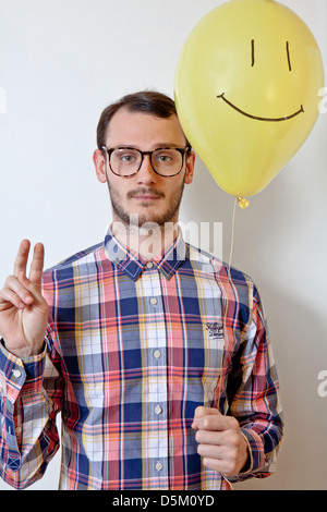 nerd with balloon Stock Photo - Alamy