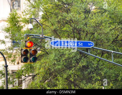 Traffic signal and speed camera sign with cars blurring by Stock Photo ...