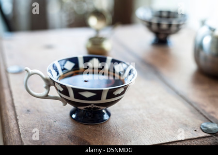 elegant table with tea cup in modern bedroom Stock Photo - Alamy