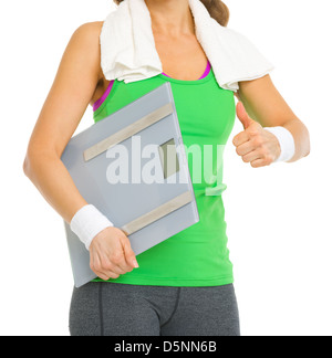 Fit and slim fitness girl showing peace sign and winking, workout in ...