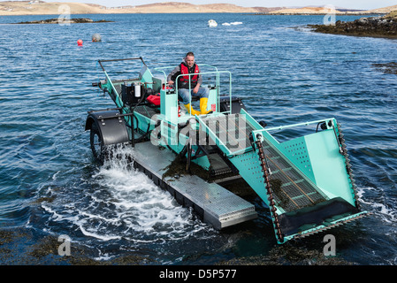 A seaweed harvesting machine in the Outer Hebrides of Scotland Stock ...