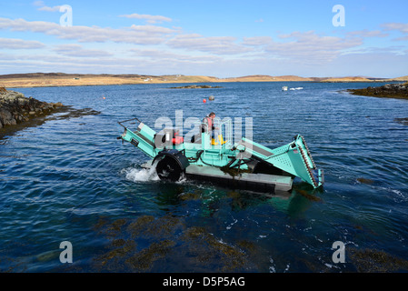 A seaweed harvesting machine in the Outer Hebrides of Scotland Stock ...